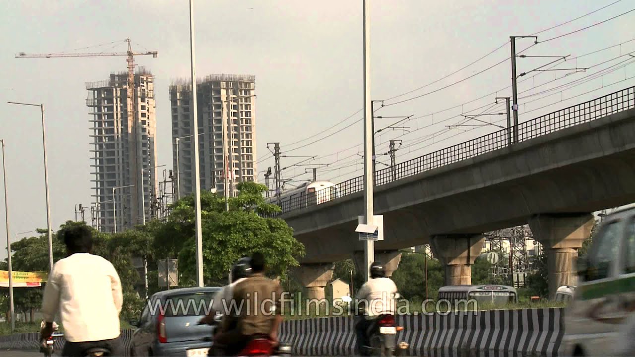 High rise building as backdrop of metro track at Noida Sector 18 - YouTube