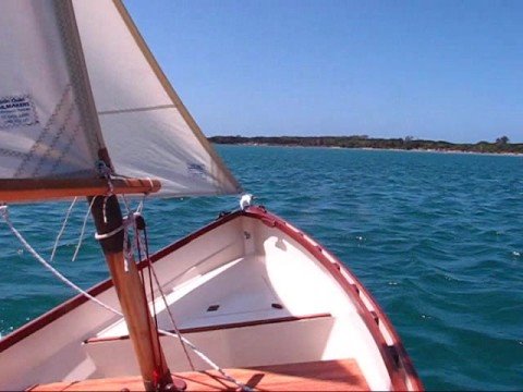 sailing wooden skiff - YouTube