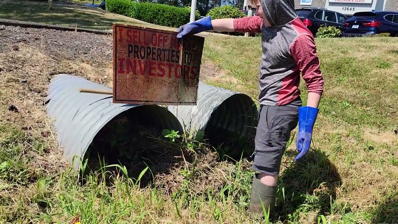 Unclogging Two Culverts - YouTube