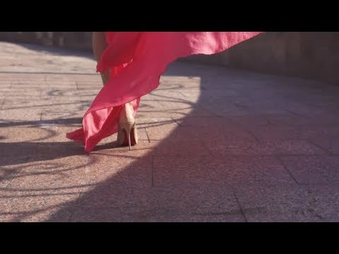 Girl in a Billowing Dress in the Wind Goes in the Rays of the Setting ...