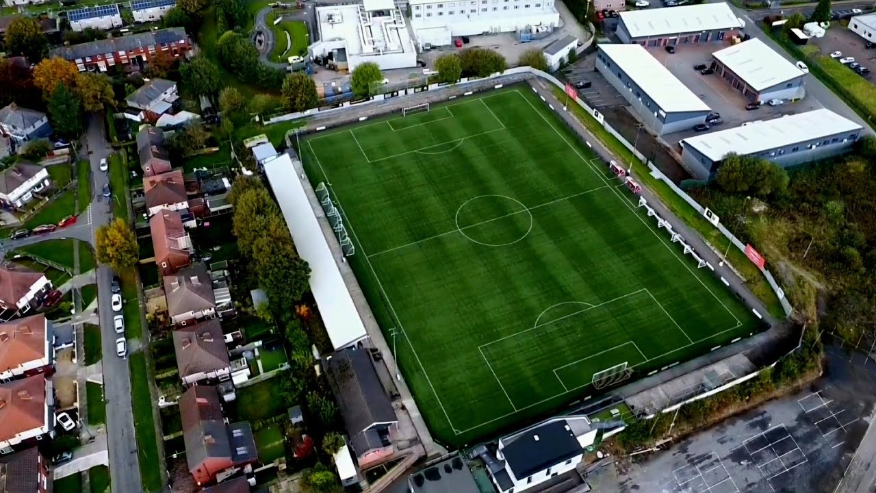 Flight out over Darwen Football Club, Darwen Cricket Club, and also ...