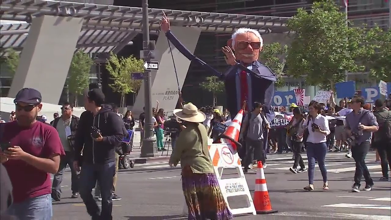 Giant walking Bernie Sanders "float" part of Downtown LA rally - YouTube