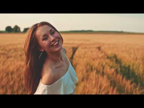 Beautiful girl running on sunlit wheat field slow motion 03