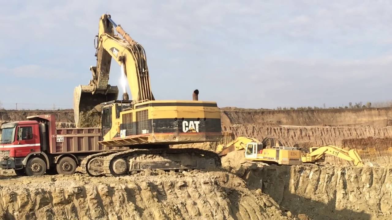 Caterpillar 385 BLME Excavator - Loading Mercedes Actros Trucks - YouTube