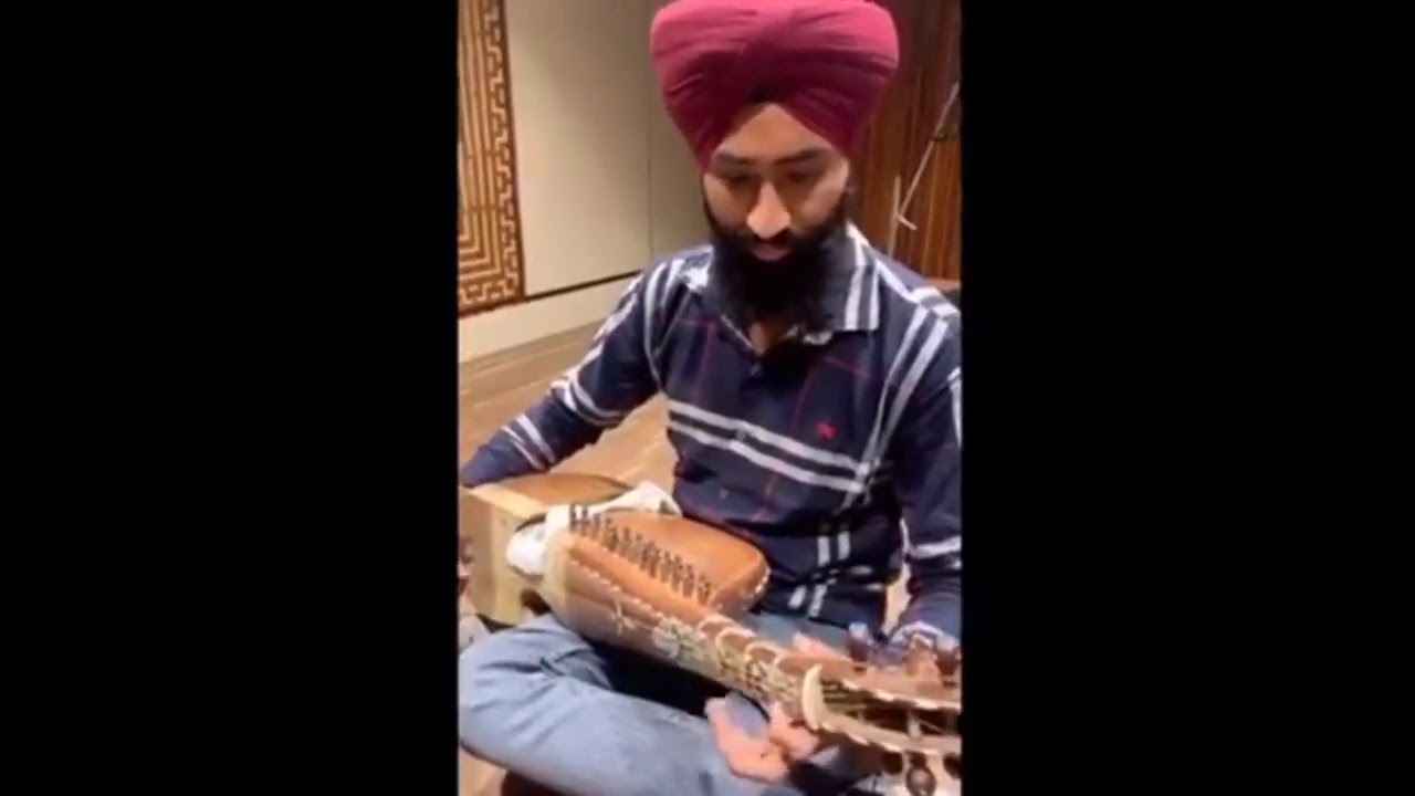 Rabab instrument playing in recording studio. Sikh musical instruments ...