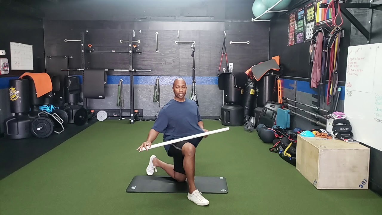 How to Perform 1/2 Kneeling T-Spine Rotations - YouTube