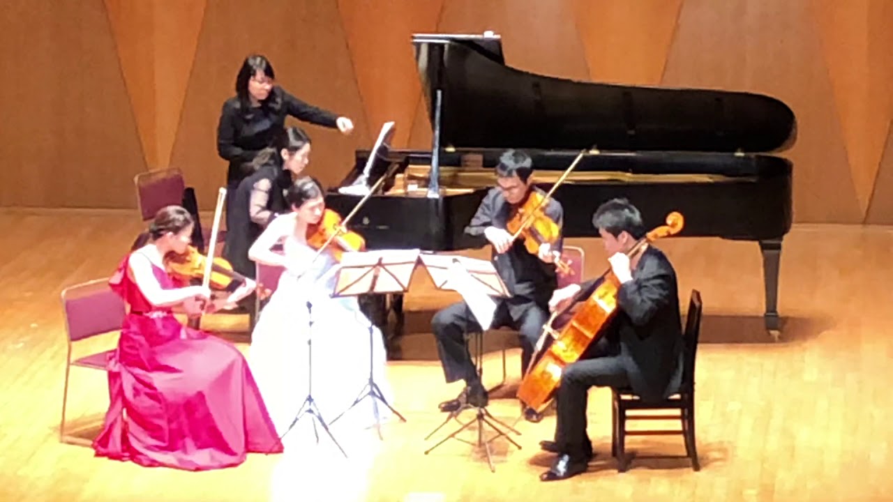 Akiko Negishi (Okada) plays a piano in Shostakovich work57, 1,3 ...
