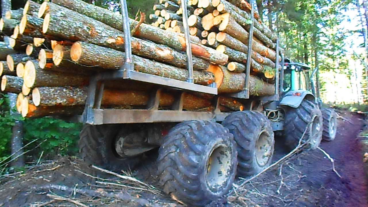 Valtra forestry tractor with large homemade trailer - YouTube