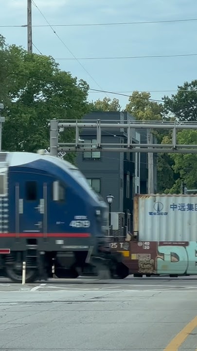 #Amtrak Carl Sandburg 381 heads west as it passes an eastbound #BNSF stack train 06.15.24 # ...