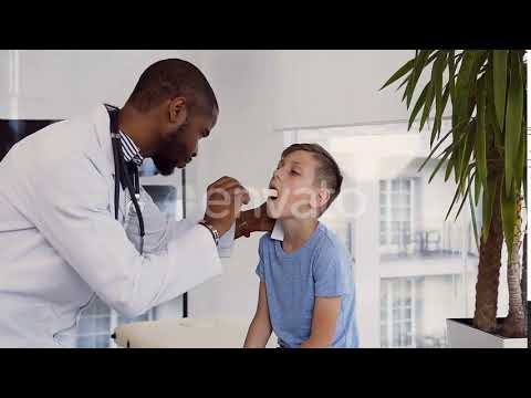 Male Doctor Pediatrician, Otolaryngologist, Inspecting Cute Little Boy Throat | Stock Footage - ...