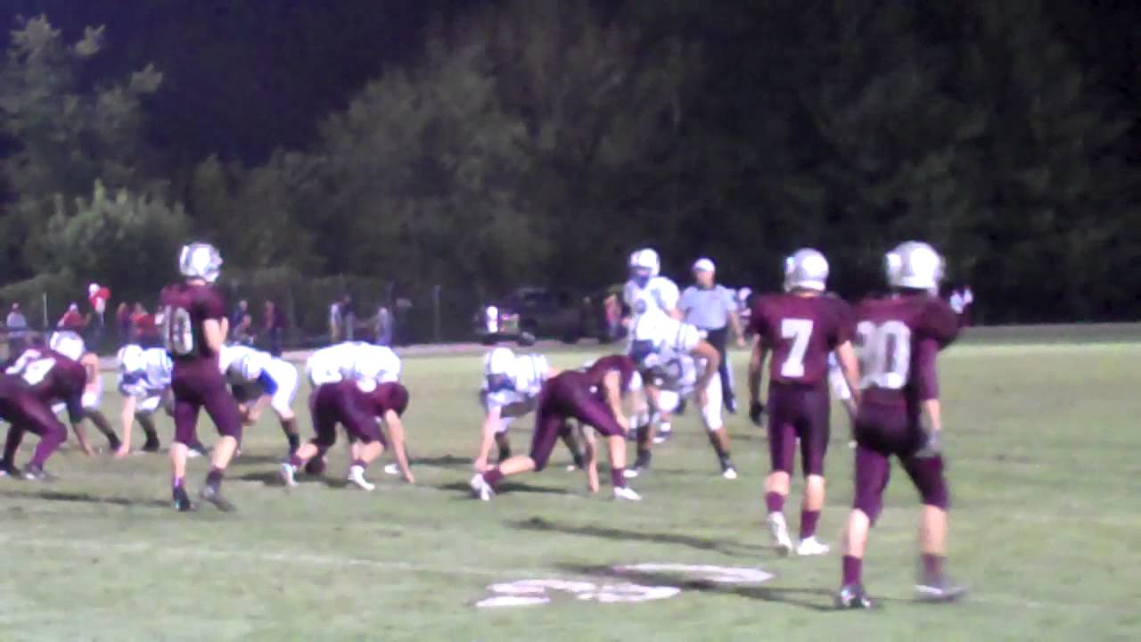 Quarterback Brock McCoin runs the ball for yardage in the game against ...