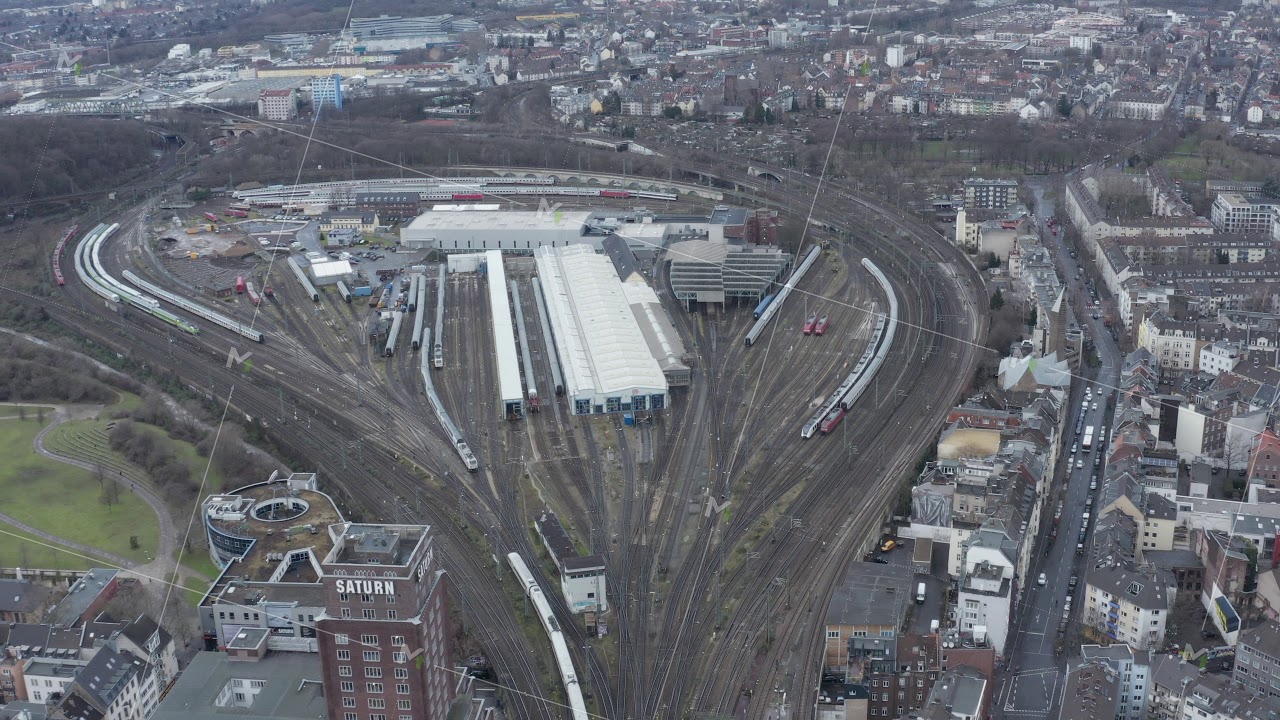 AERIAL: Over Cologne Railway Train system with Train driving on Cloudy ...