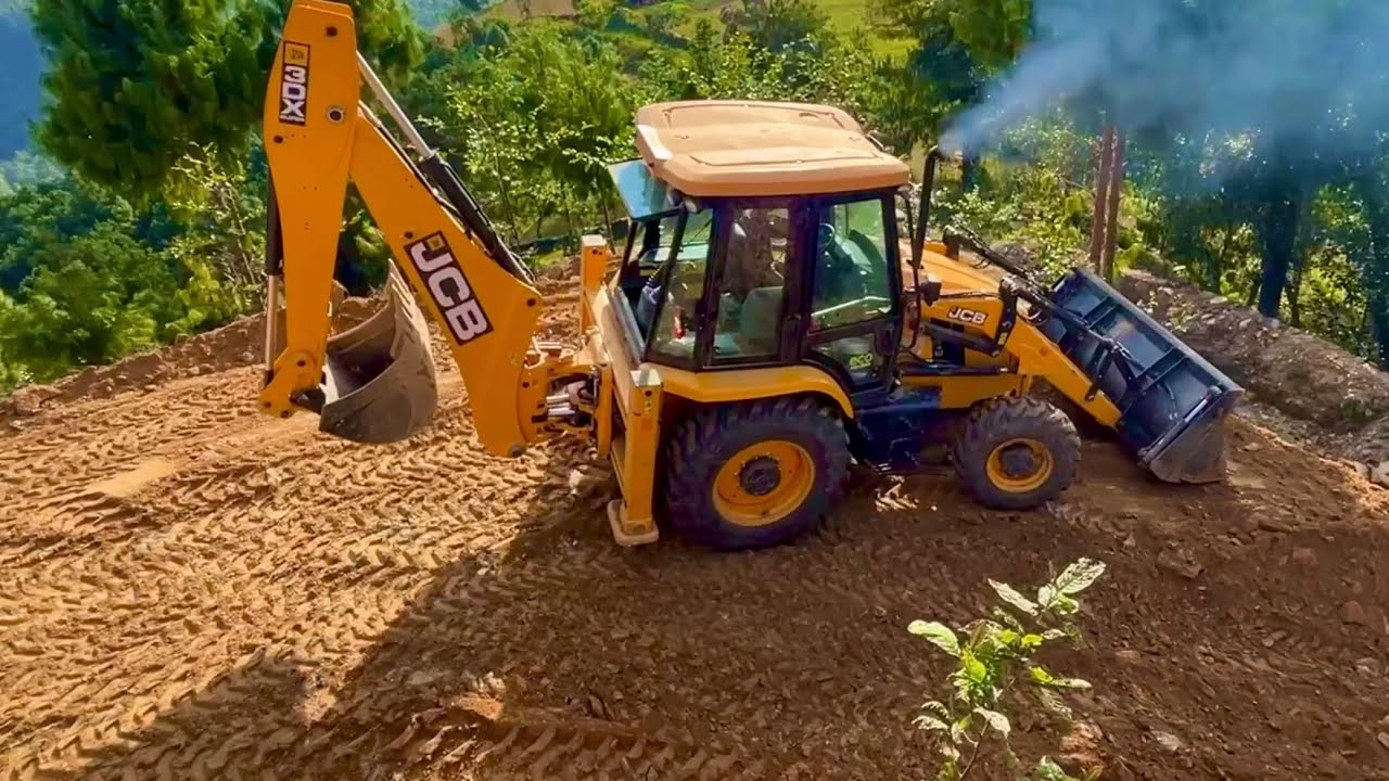 JCB Backhoe Building A Road And Clearing Massive Stones from the Ground ...