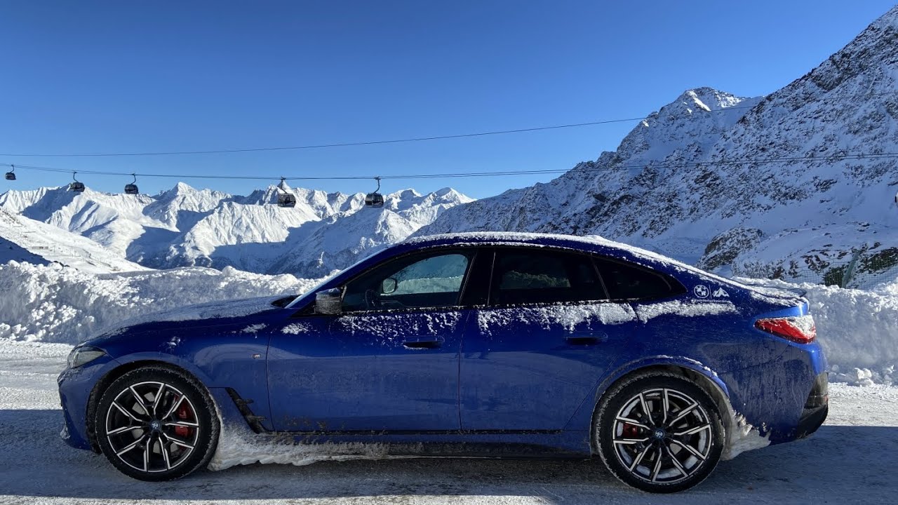 2022 BMW i4 M50 G26 Gran Coupé in M Portimao Blau in the snow - YouTube