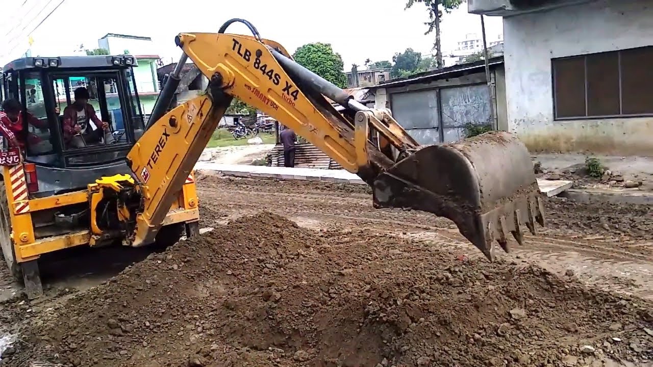 Excavator at Work - Hydraulic Excavator busy on Road Construction All ...