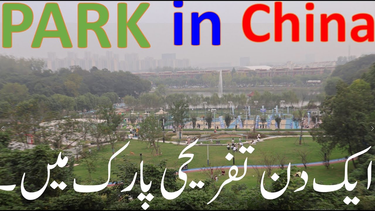 A beautiful public park in China lies surrounded by a mountain ...