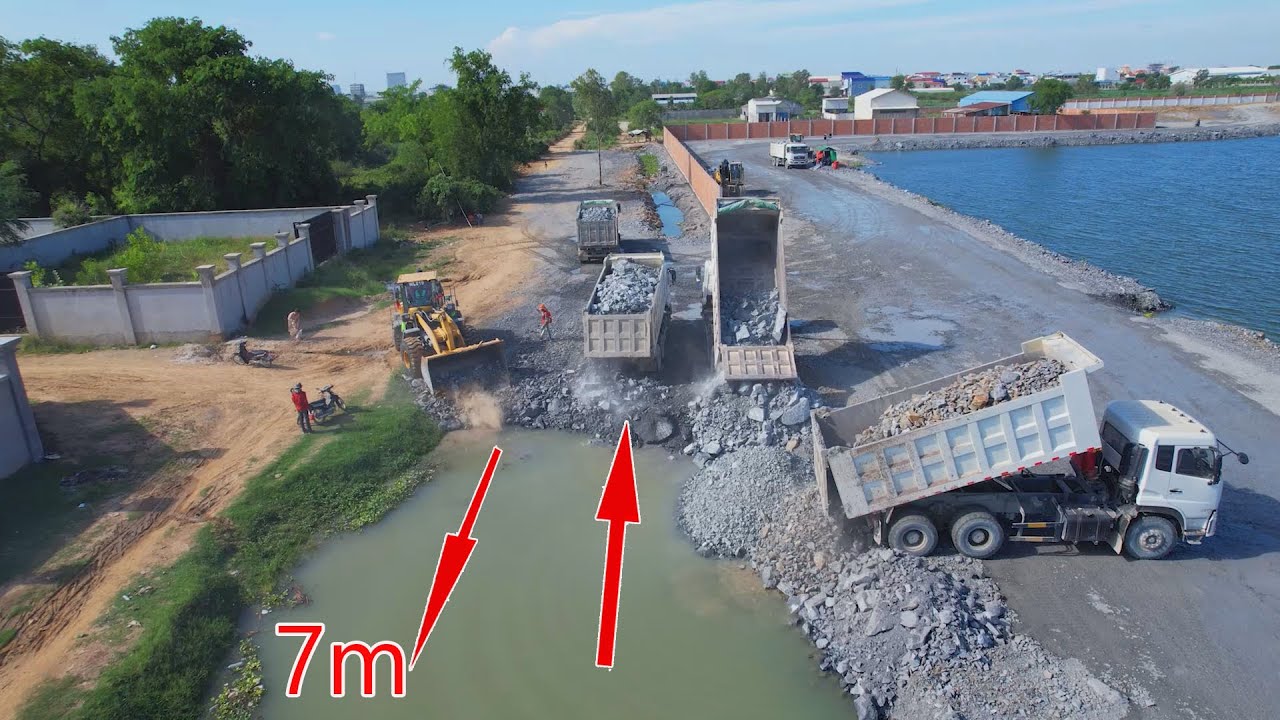 Big Moving Rock Operator Dump Trucks Fill The Soil With Water By Loader ...