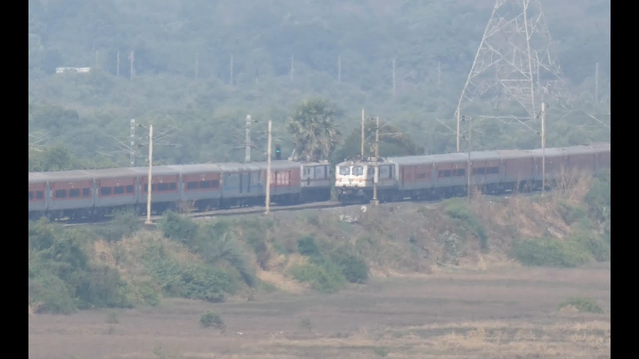 Magnificent view of Paschim Express crossing Paschim Express at scenic ...