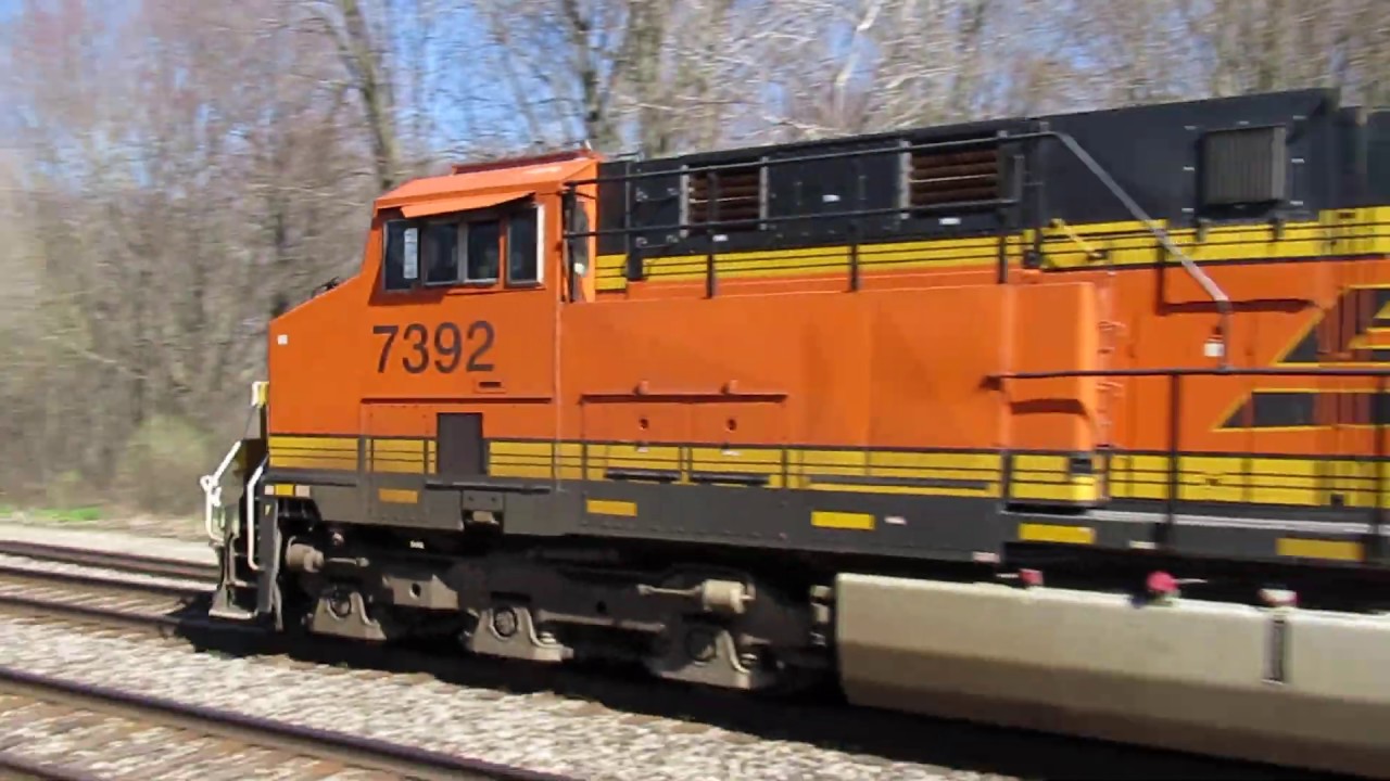 BNSF 7392, 6762 speeding East with empty TTX flat cars for turbine blades at Vicksburg, MI - YouTube
