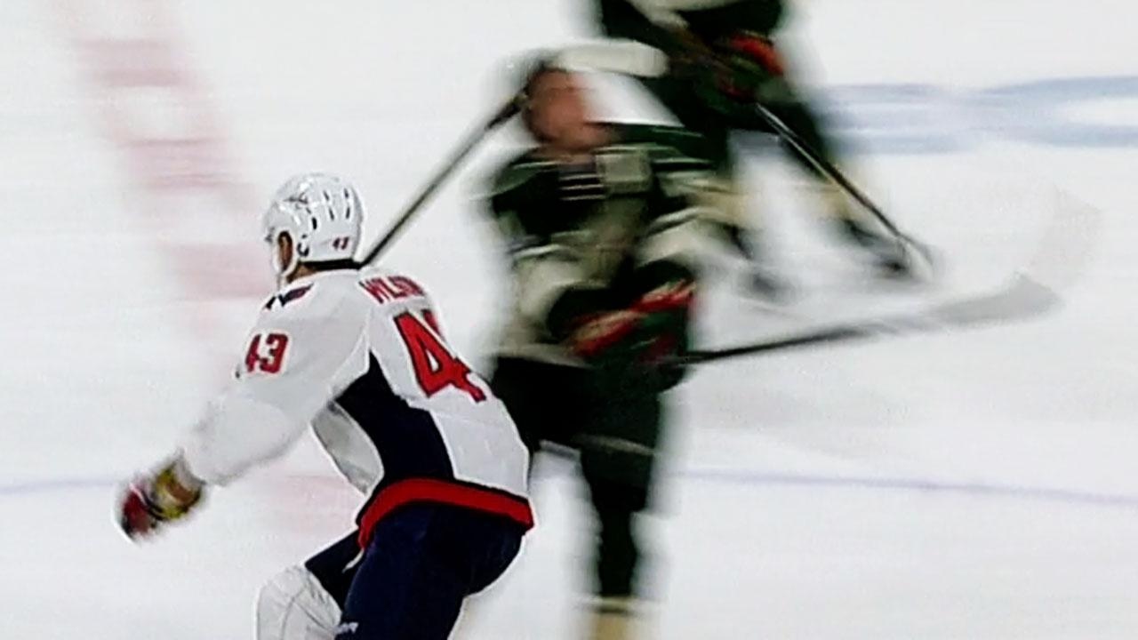 Parise helped off after taking fluke high stick at centre ice - YouTube