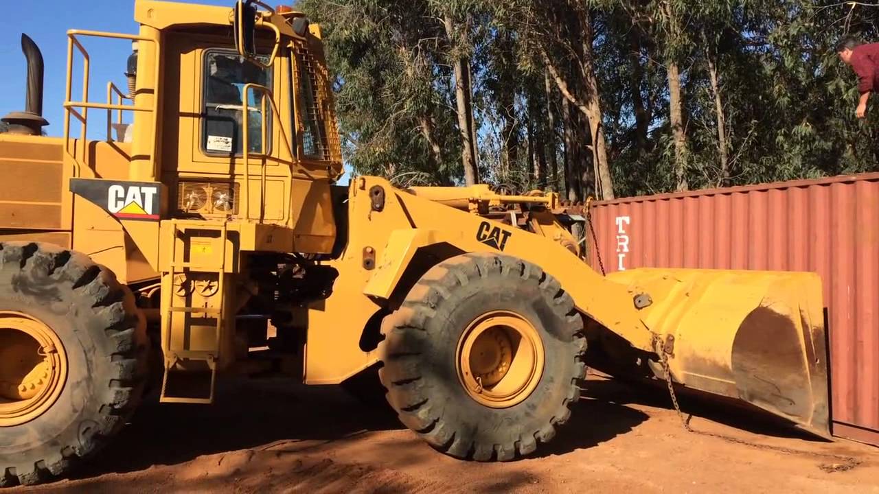 Loader moving sea container - YouTube