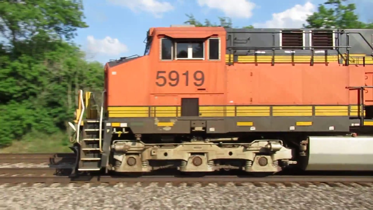 BNSF 5919 towing a TTX flat car train for turbine parts over the CN's GTW through Vicksburg, MI ...