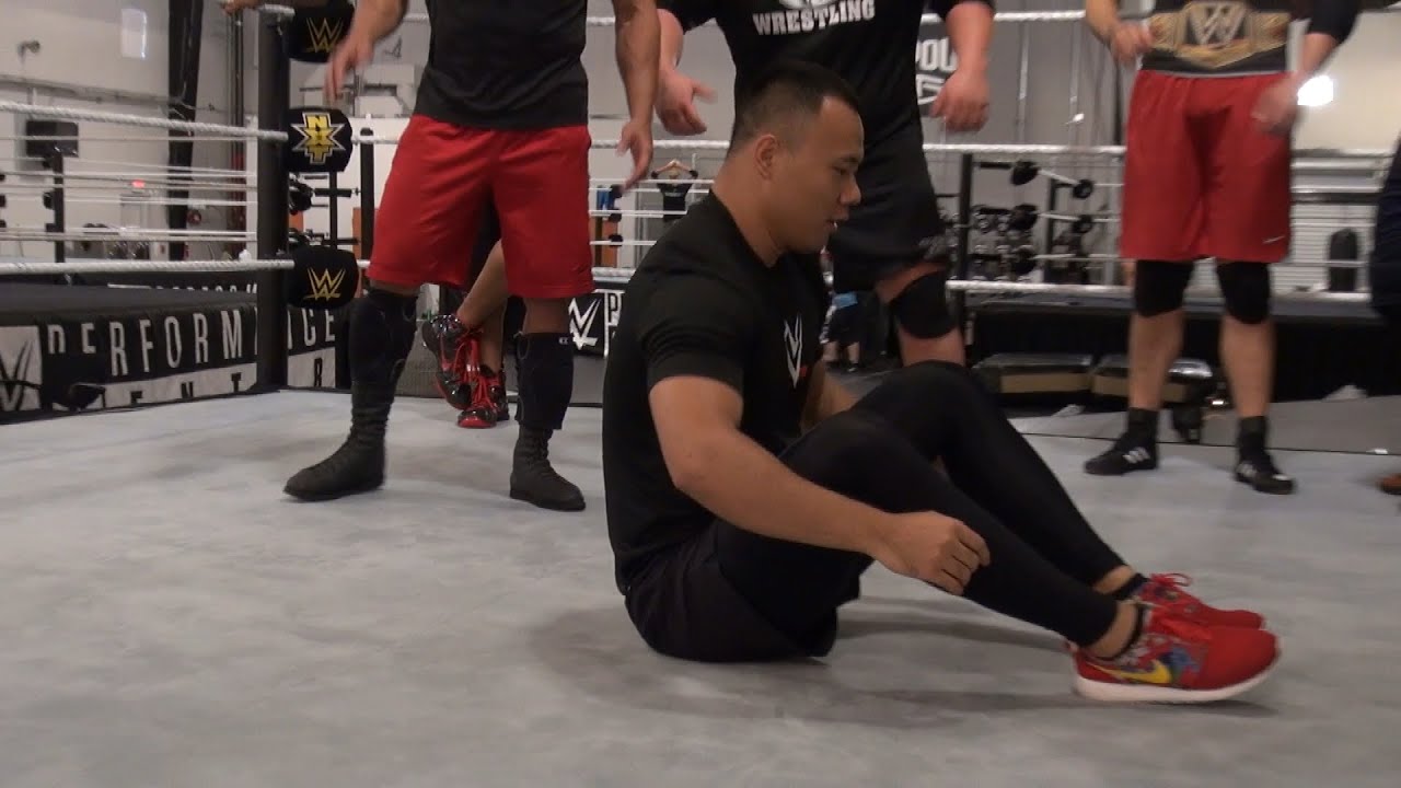 Bin Wang practices kip-ups at the WWE Performance Center - YouTube