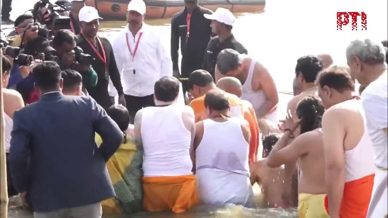 UP CM Yogi Adityanath along with other cabinet ministers take a holy dip in the Sangam ...