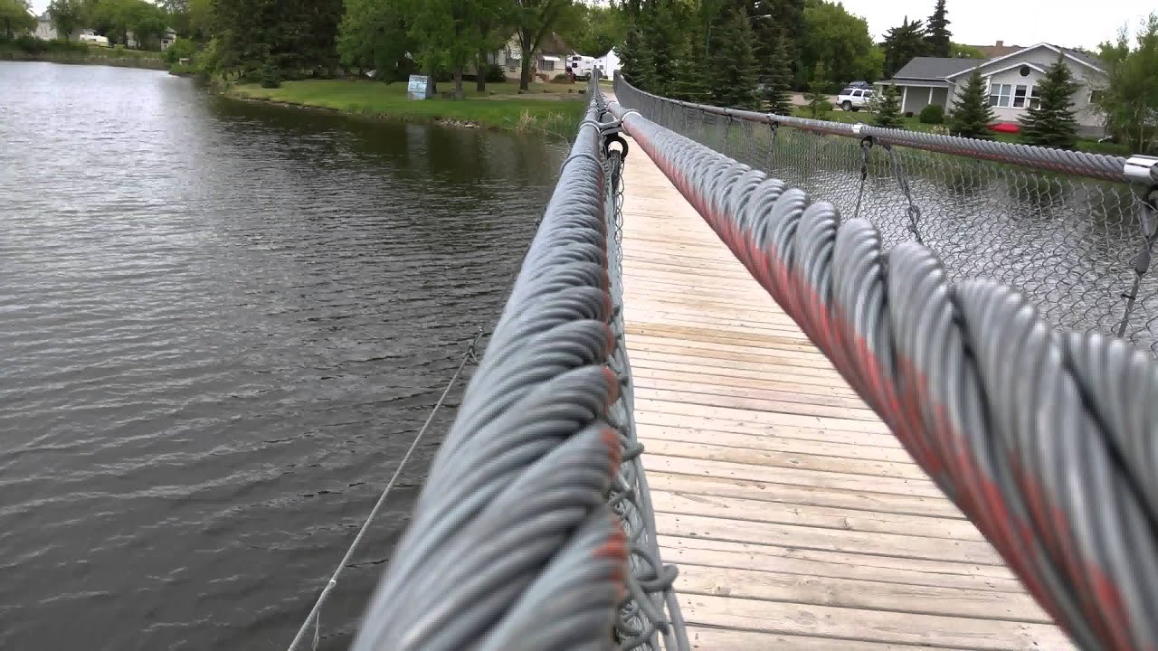 Walking across the Town of Wolseley's swinging bridge - YouTube