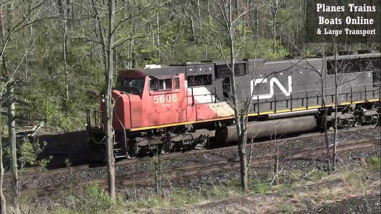CN 424 Manifest Train CN 5606 & CN 8012 Locomotives Denfield Rd Bridge - YouTube