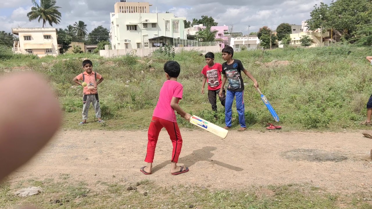 My son playing galli cricket - YouTube