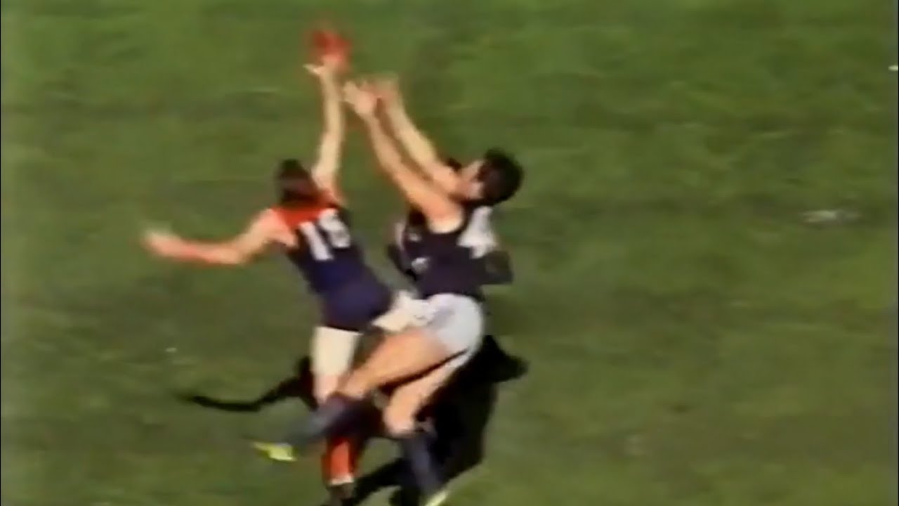 1990, Rd 11 - Steven Stretch marks in front of Justin Madden ...