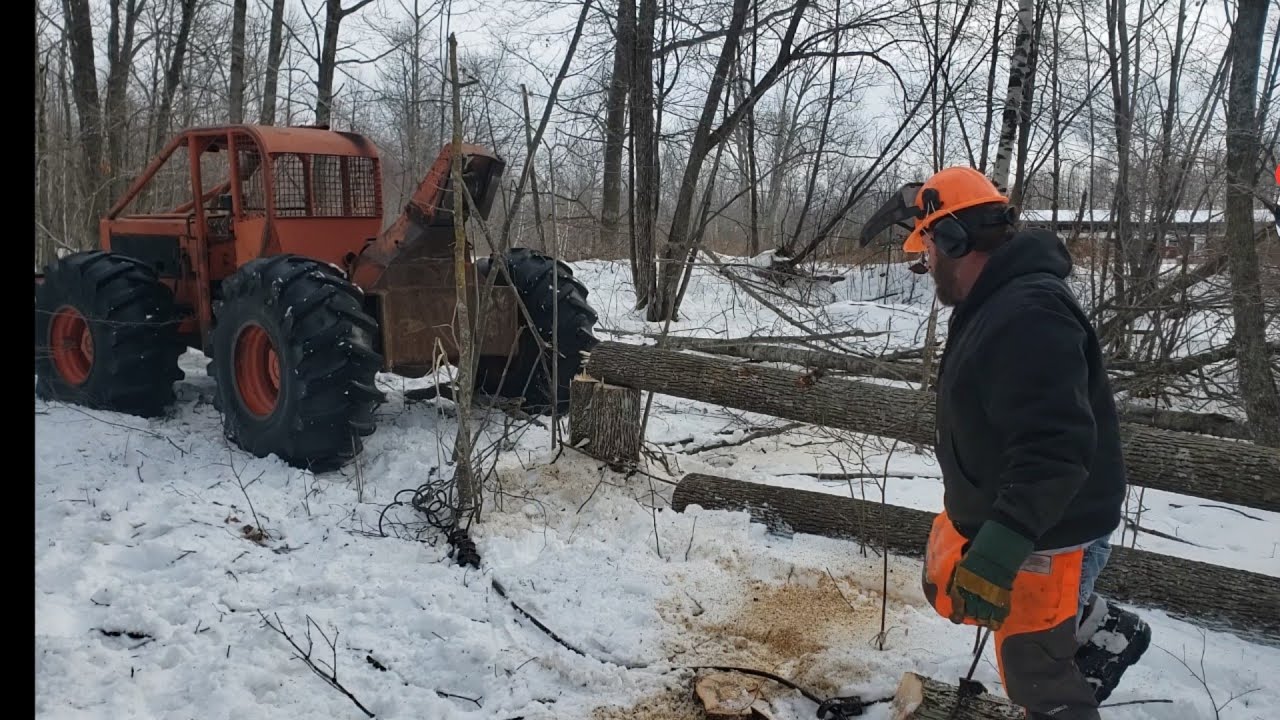 Dropping Trees and Pulling Skids a Timberjack Video. - YouTube