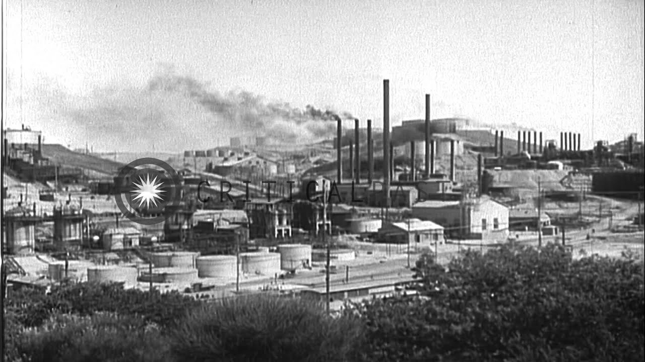 View at oil storage tanks and factories during World War II. HD Stock ...