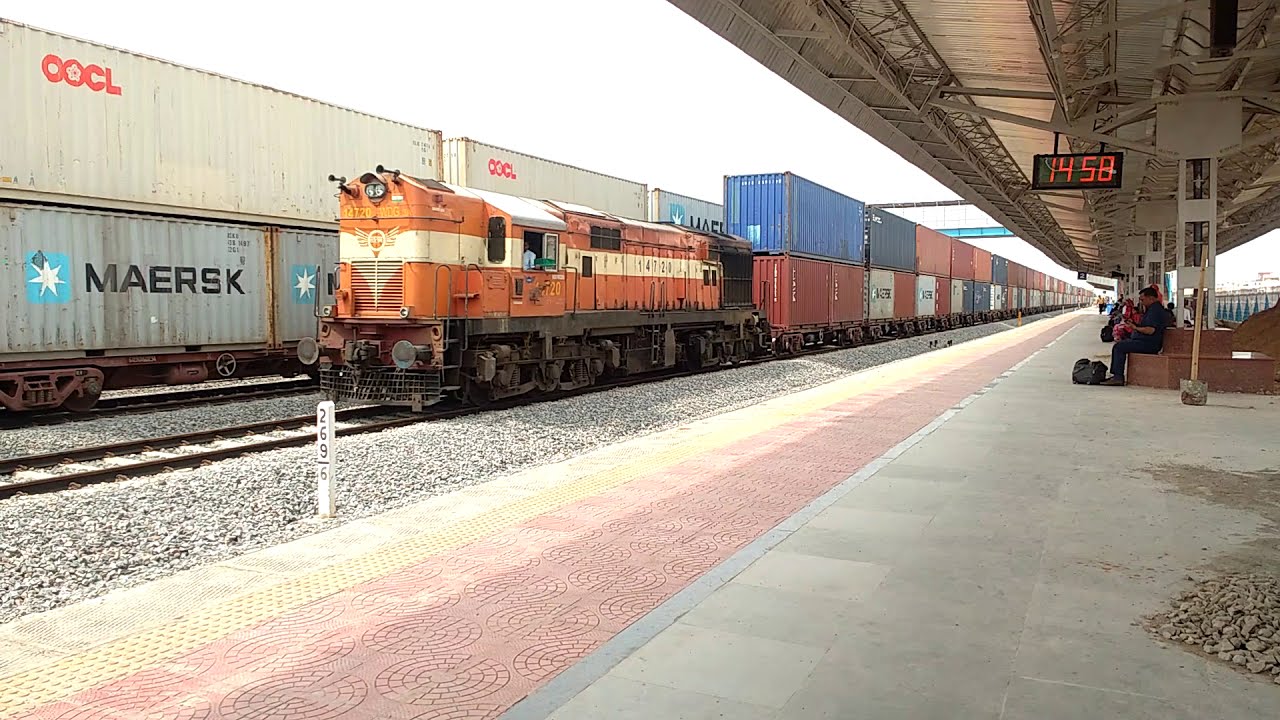 Double stack container trains crossing each other - YouTube