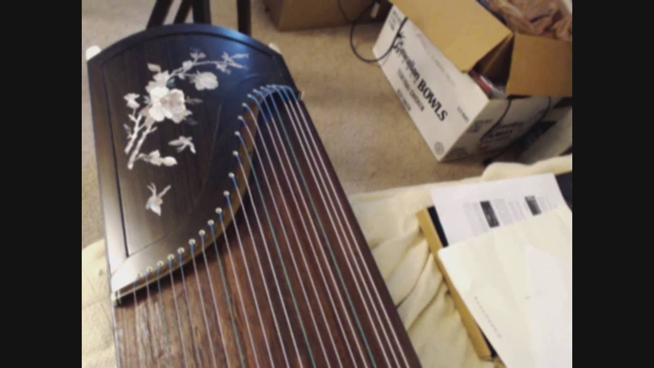 Playing the Guzheng for the first time - Chinese musical instrument ...