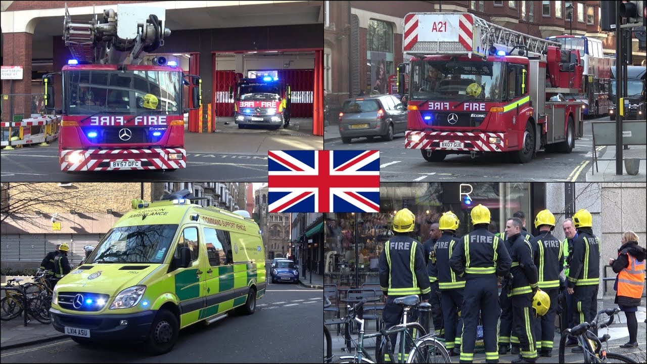 High rise - Fire trucks and ambulances responding with siren and lights ...