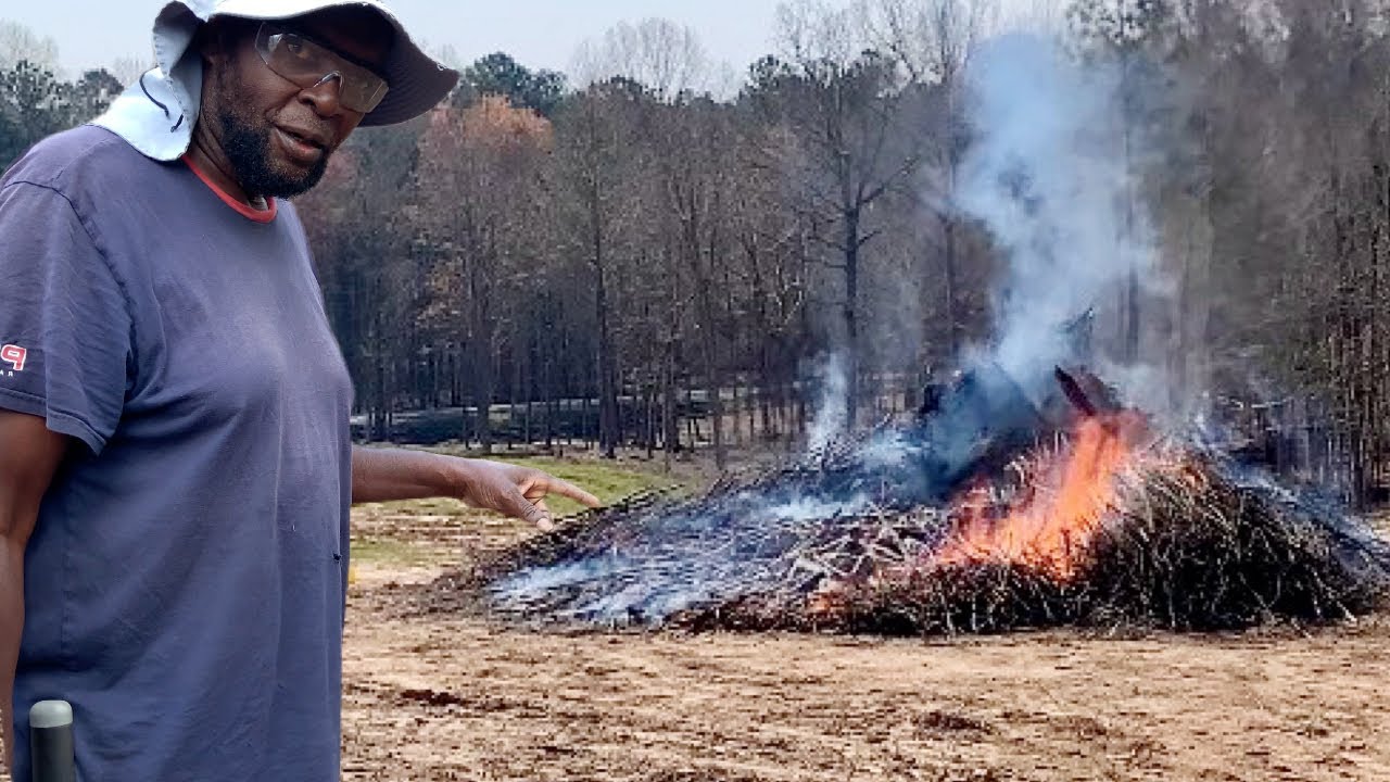 Clearing Trees With a U-Haul Truck (HUGE burn Pile Fire) - YouTube