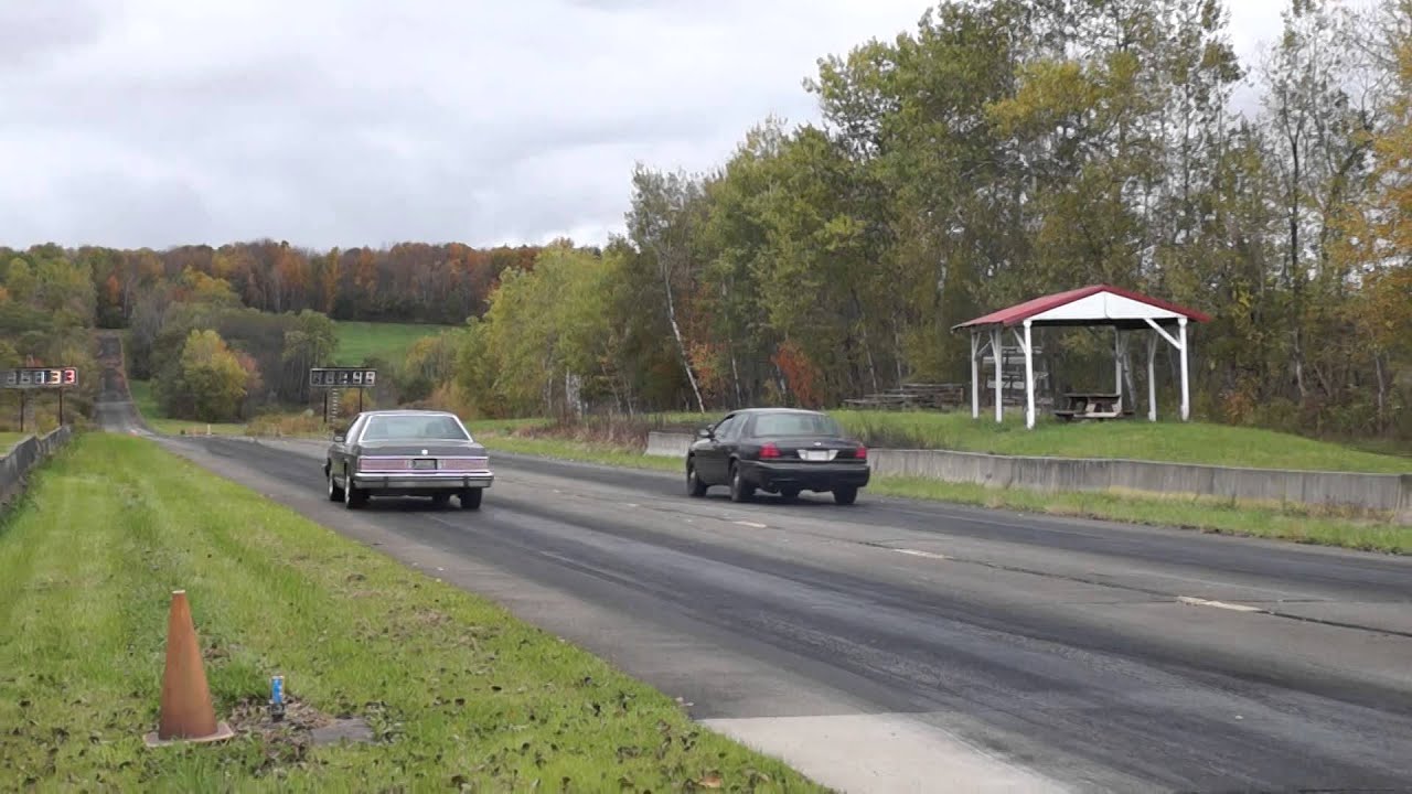 supercharged crown victoria vs grand marquis drag race - YouTube