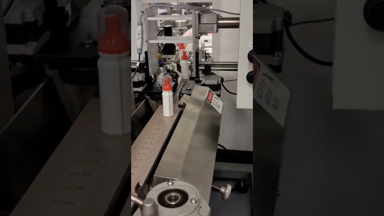 In-House Built J&J Bottle Orienter for Sight-Line Bottle Labeling - YouTube