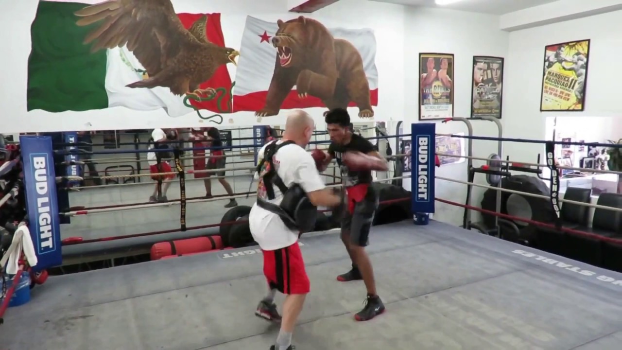 Carlos Morales works the mitts with “The Pasadena Kid” Joey Olivera ...