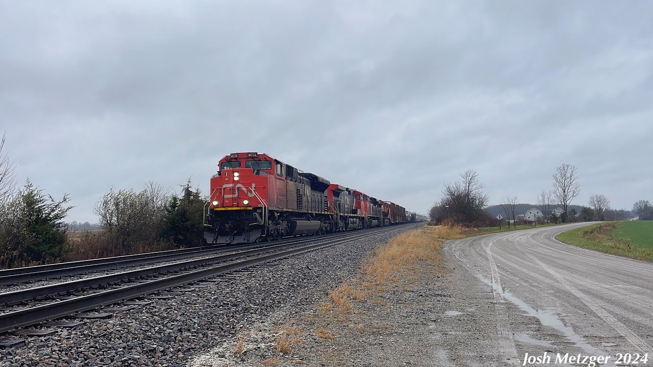 CN M39671-14 w/ CN SD70M-2s #’s 8922 and 8810, CN C44-9W #2704, and CN ET44AC #3010 @ Durand, MI ...