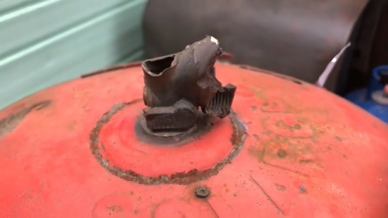 Busted valve, have to Drill the propane tank. Yeek - YouTube