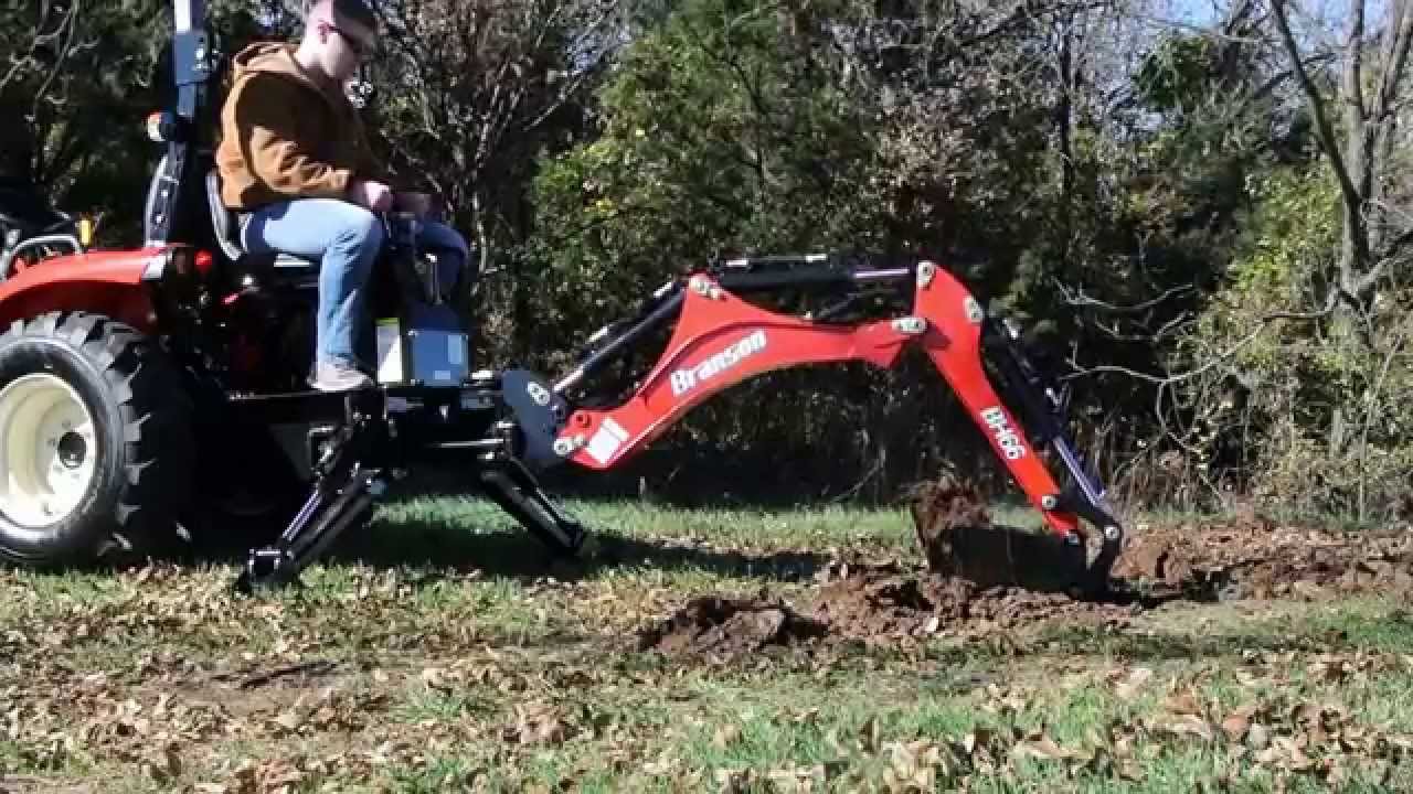 Demo of Branson 2400h with Sub Frame Backhoe - YouTube