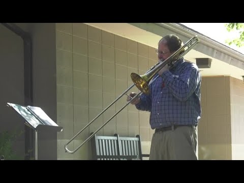 Man plays trombone concert outside brother's rest home - YouTube