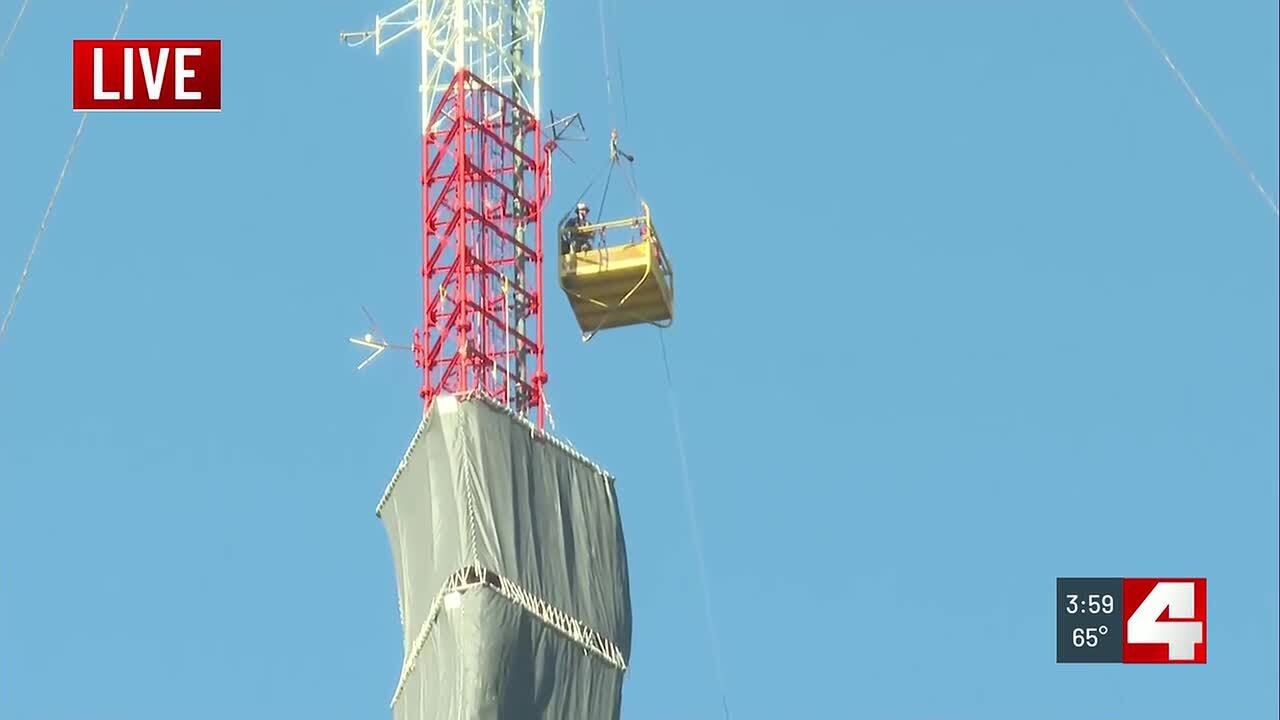 Crews rescue man on top of TV tower in St. Louis County - YouTube