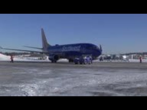 Airport worker stays positive in Midwest cold snap