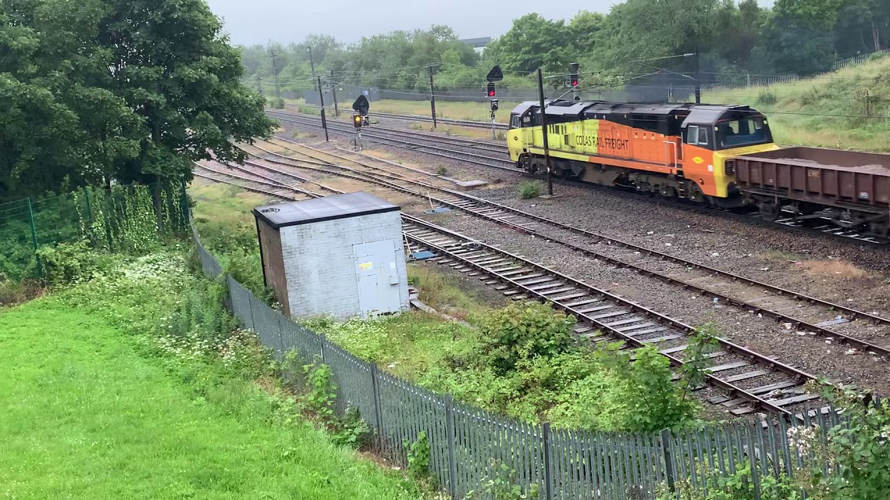 Colas Class 70815 with ballast wagons passes Darlington on Millerhill ...