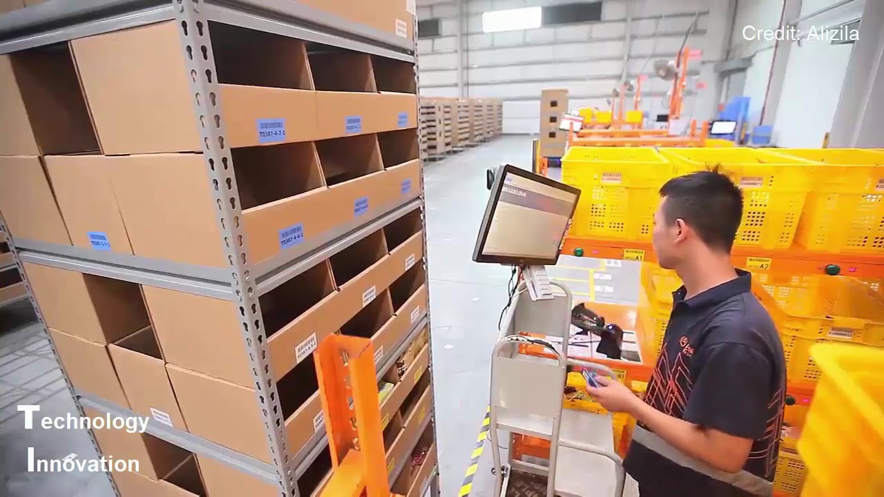 Inside Alibaba's Smart Warehouse - YouTube