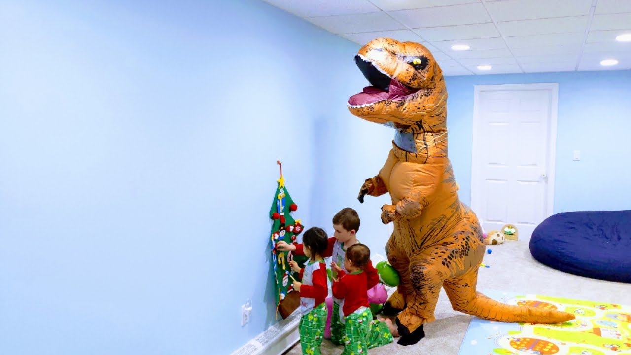 T Rex help kids with Christmas tree - YouTube